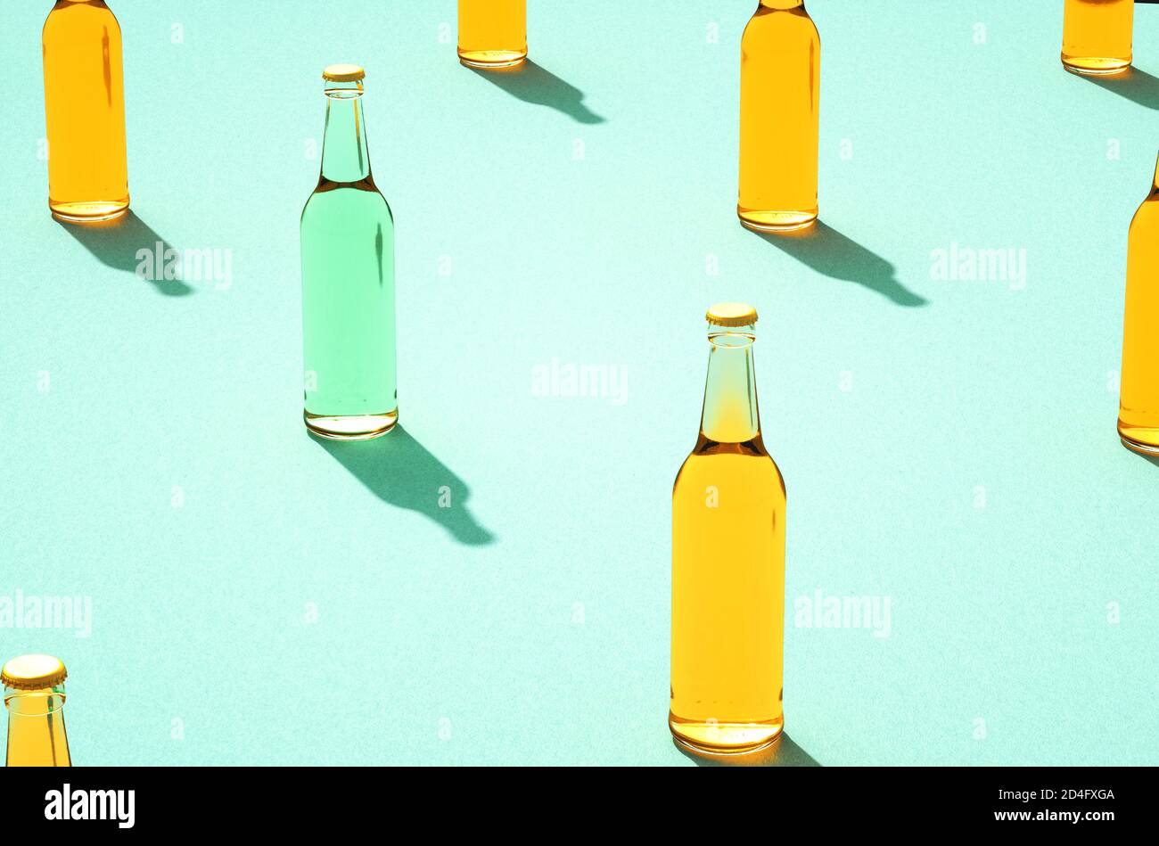 Several glass beer bottles with shadows on light blue background. Full ...