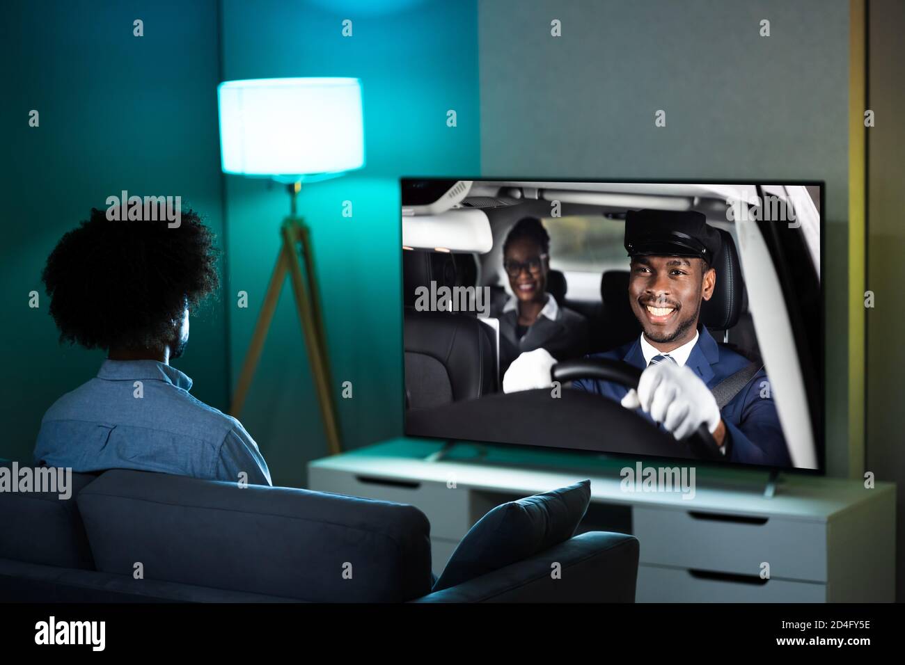 African American Streaming And Watching Movie On TV Screen Stock Photo ...