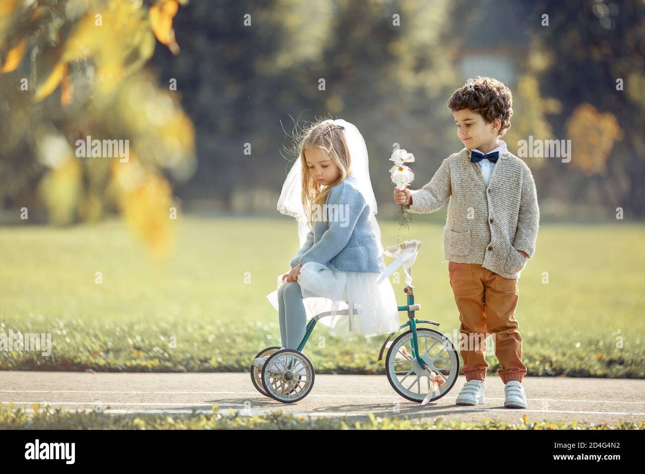 children bride and groom on a bicycle Stock Photo - Alamy