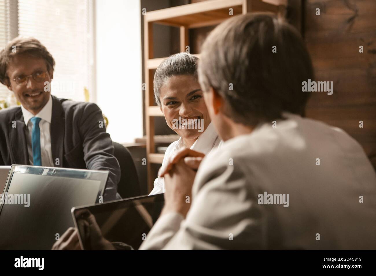 Funny business people. Happy office staff smiles each other during ...