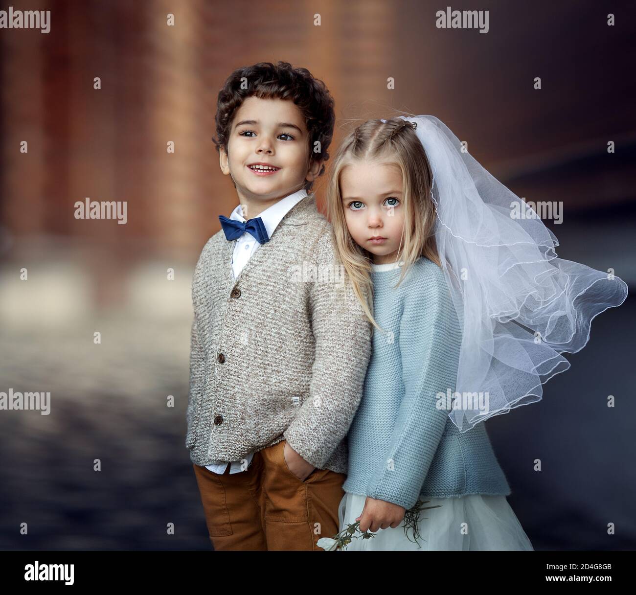 boy and girl dressed as bride and groom Stock Photo - Alamy