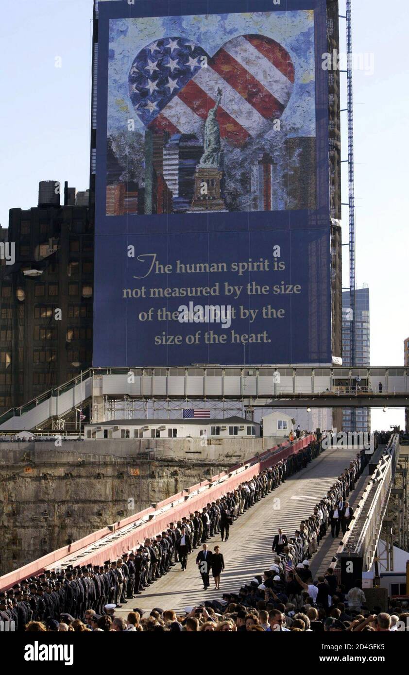 President Bush and first lady Laura Bush through a cordon of law ...