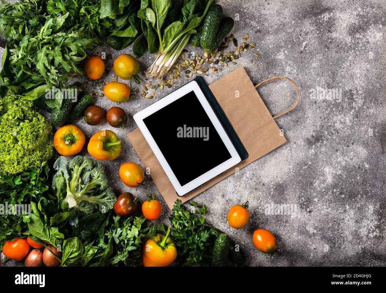 Order delivery food concept. Tablet computer and shopping paper bag ...