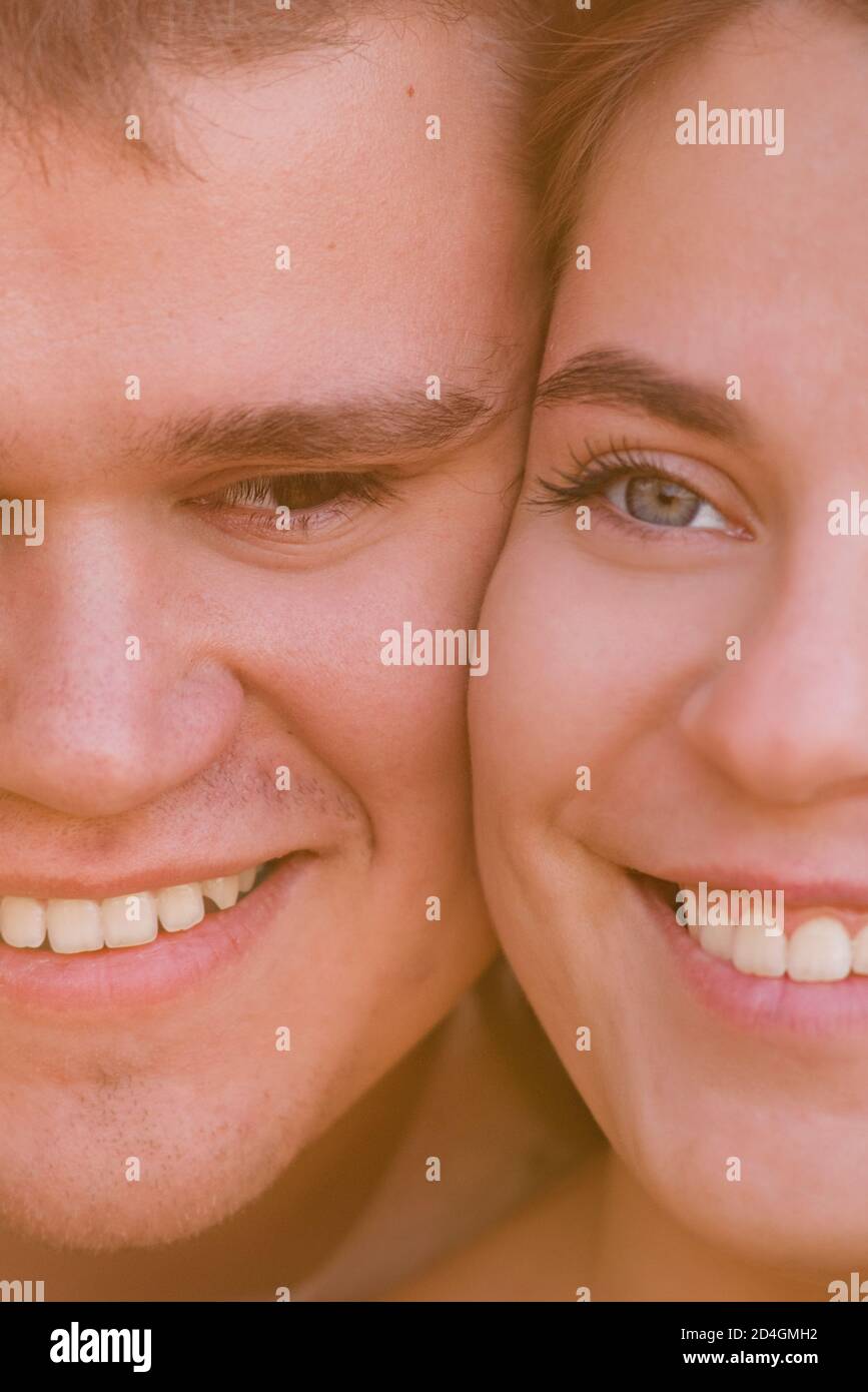 A very close-up portrait of couple in love, a young man pressed his ...