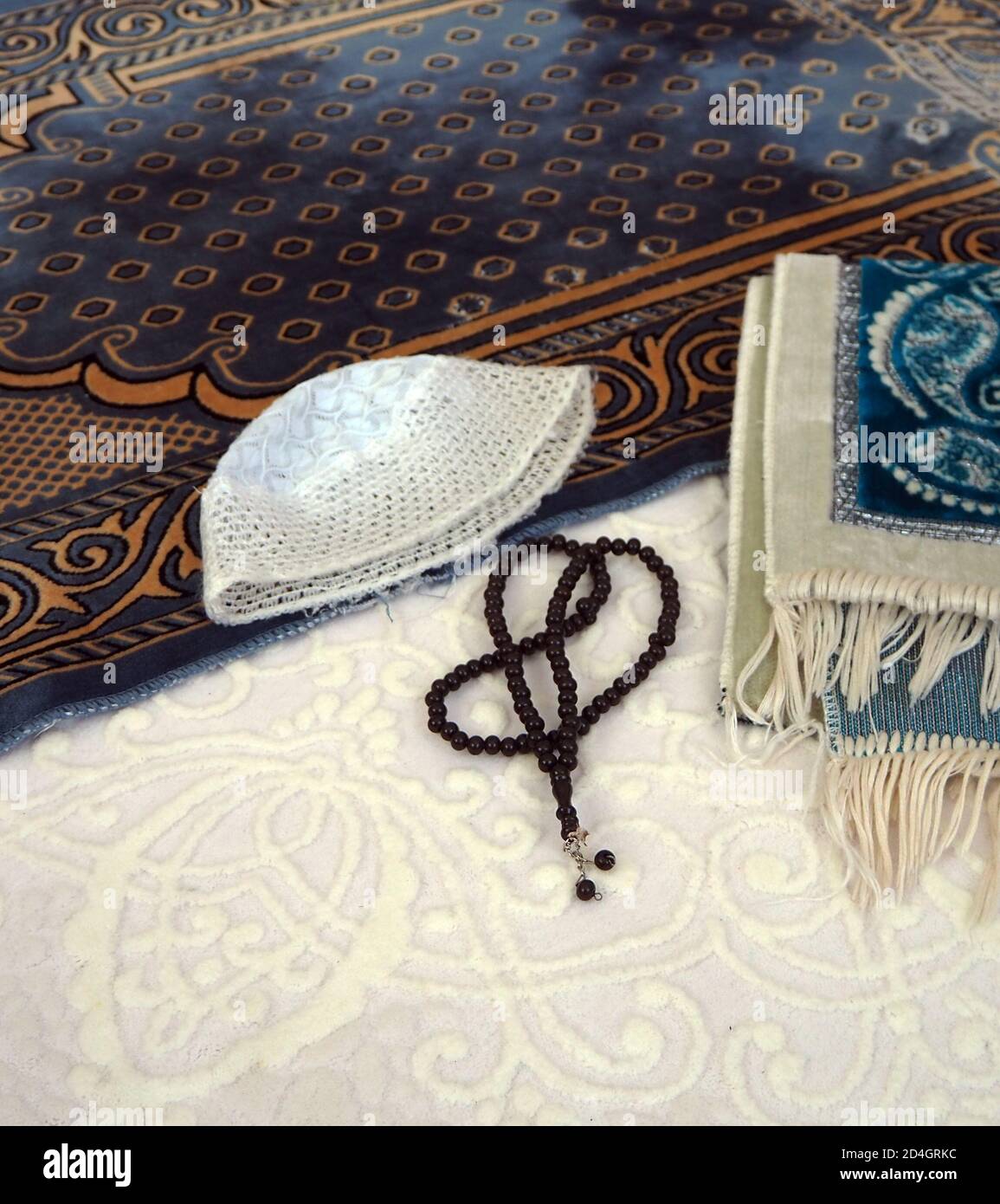 Worship tools and materials, prayer rug, rosary and skullcap in islam ...