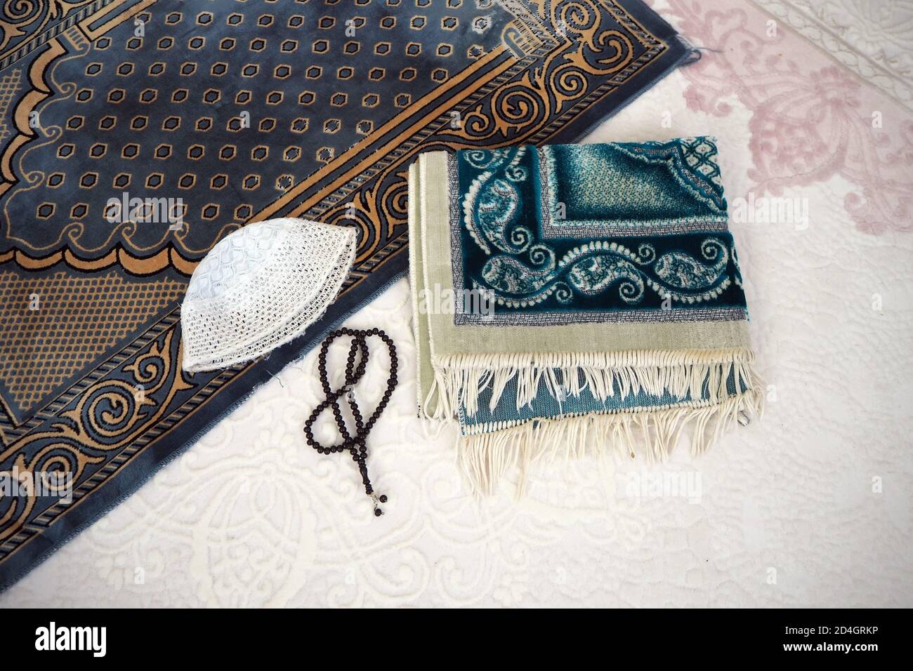Worship tools and materials, prayer rug, rosary and skullcap in islam ...