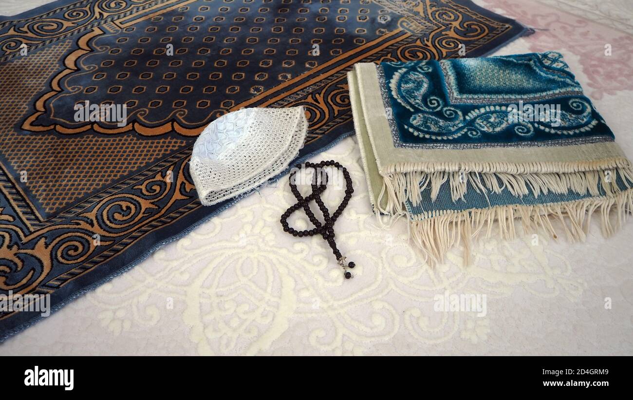 Worship tools and materials, prayer rug, rosary and skullcap in islam ...