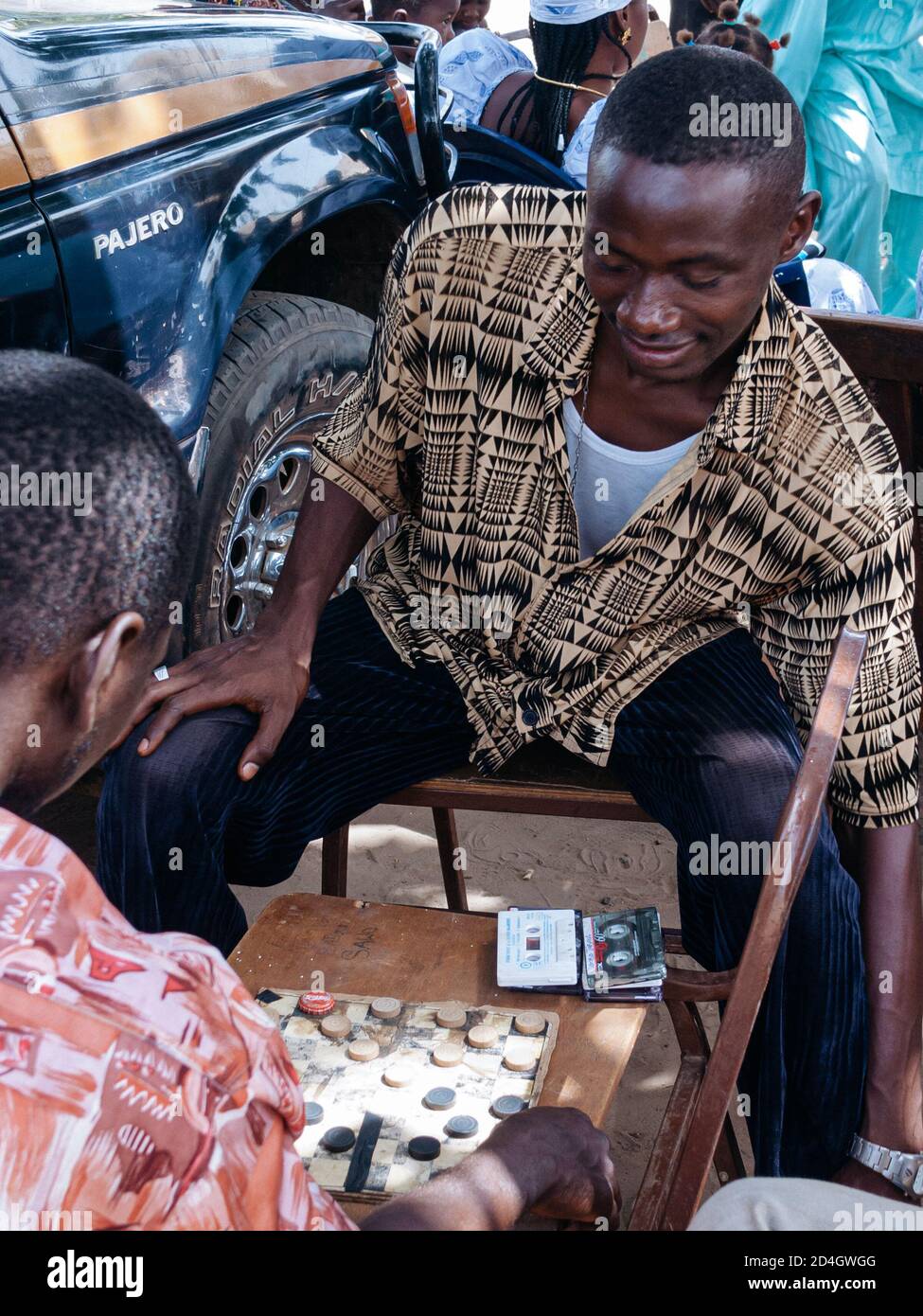 two young men playing checkers Stock Photo - Alamy