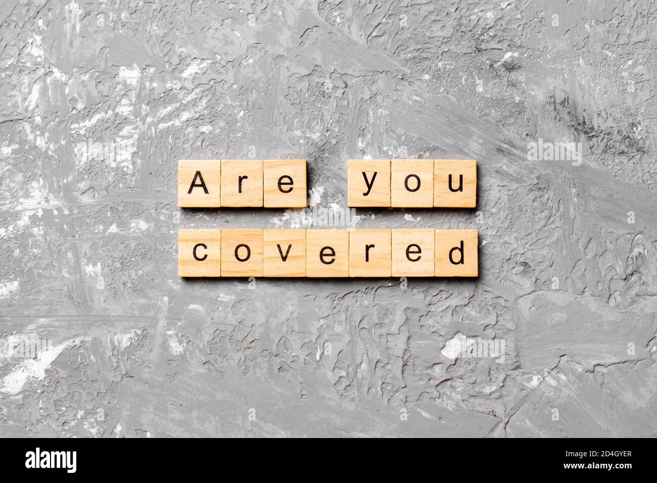 are you covered word written on wood block. are you covered text on ...