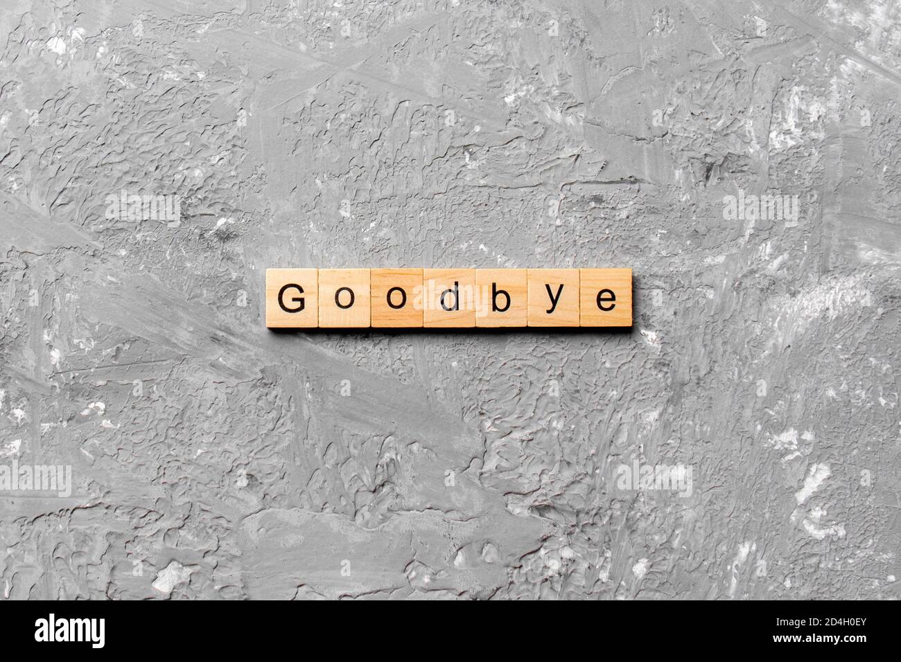 Goodbye word written on wood block. Goodbye text on table, concept ...