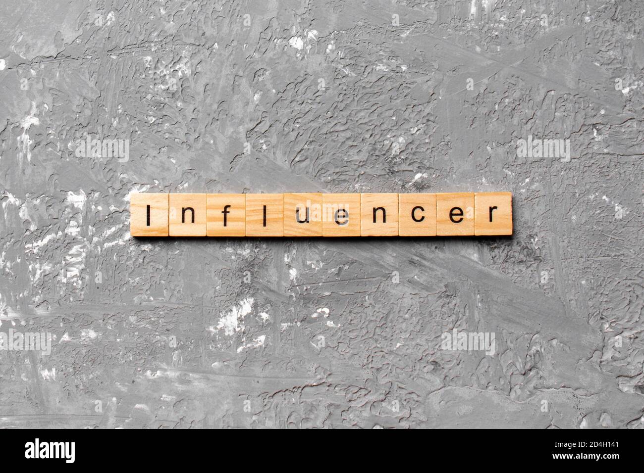 influencer word written on wood block. influencer text on table ...