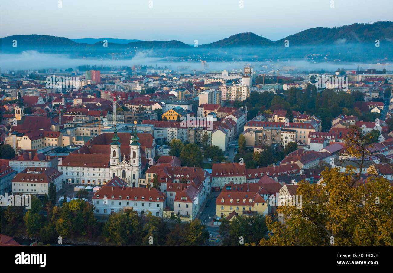 Cityscape of Graz with Mur river and Mariahilfer church ...