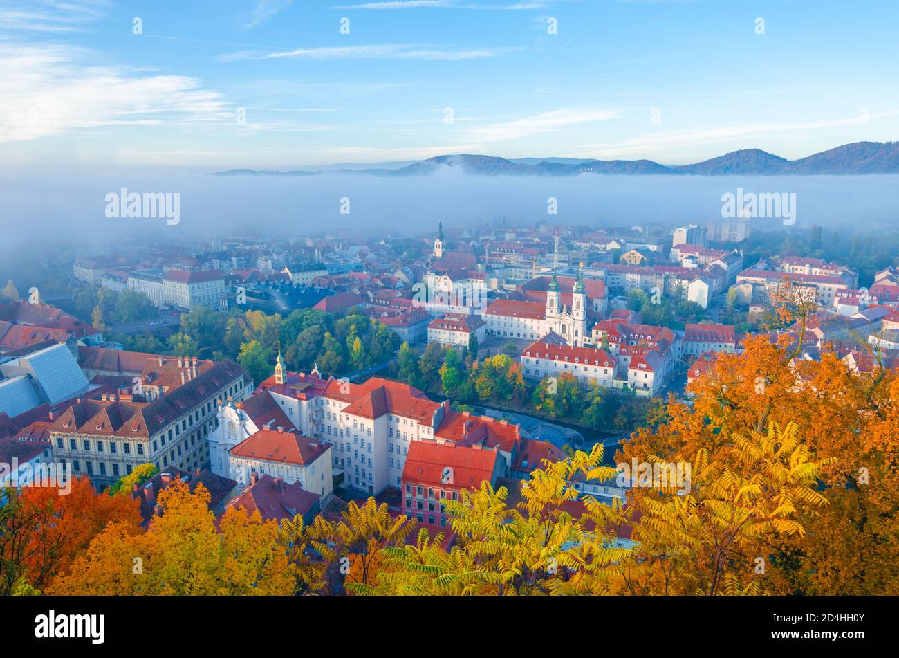 Cityscape of Graz with Mur river and Mariahilfer church ...