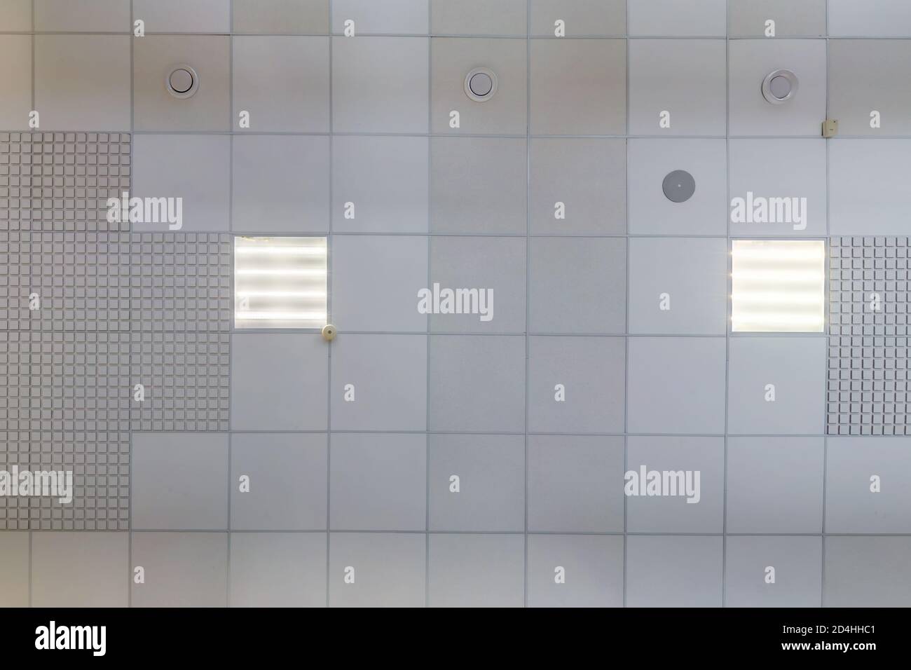 cassette suspended ceiling with square halogen spots lamps and drywall ...