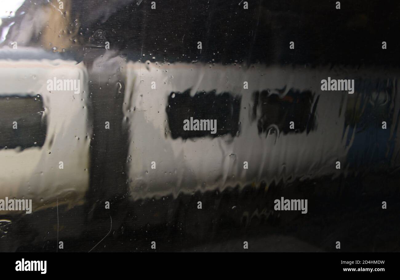 View from a train with torrential rain pouring down the window bound ...