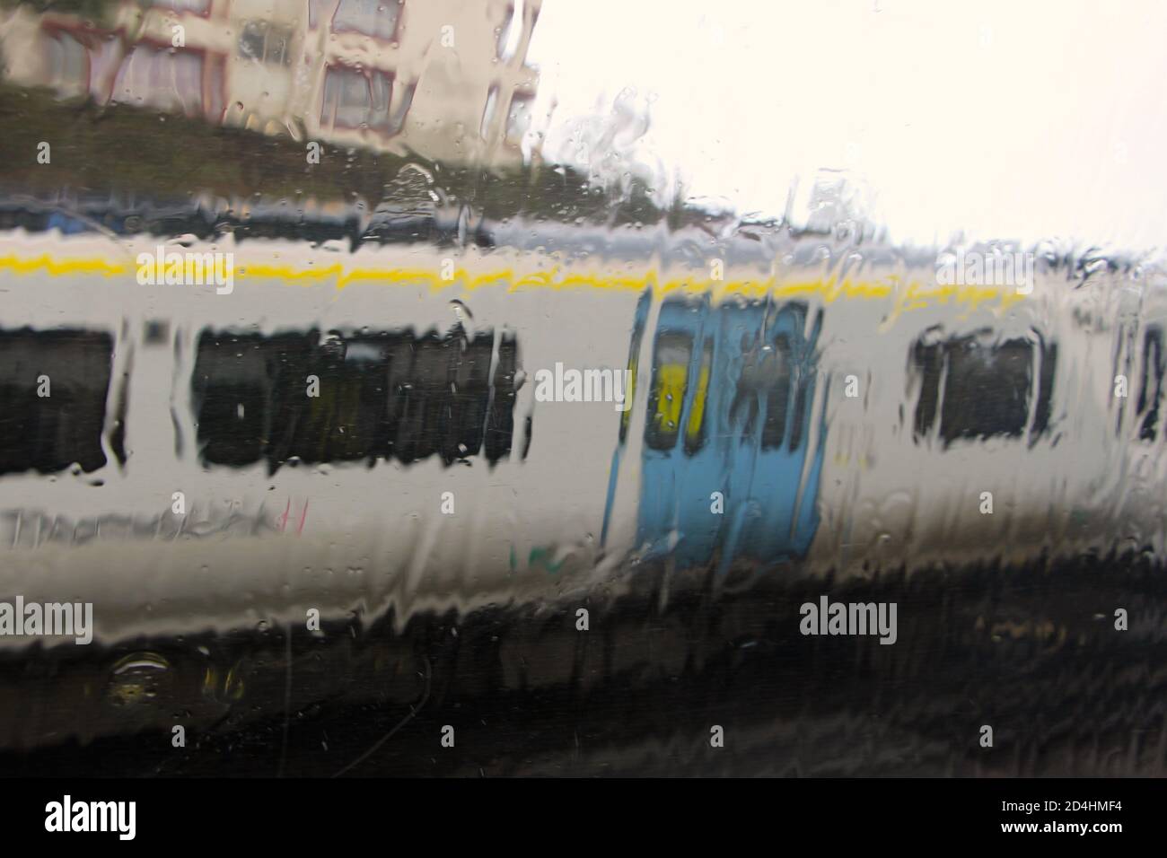 View from a train with torrential rain pouring down the window bound ...