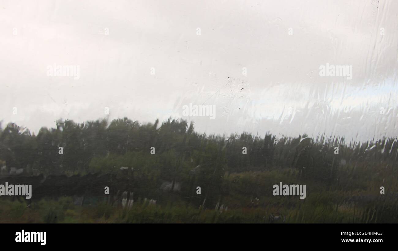 View from a train with torrential rain pouring down the window bound ...