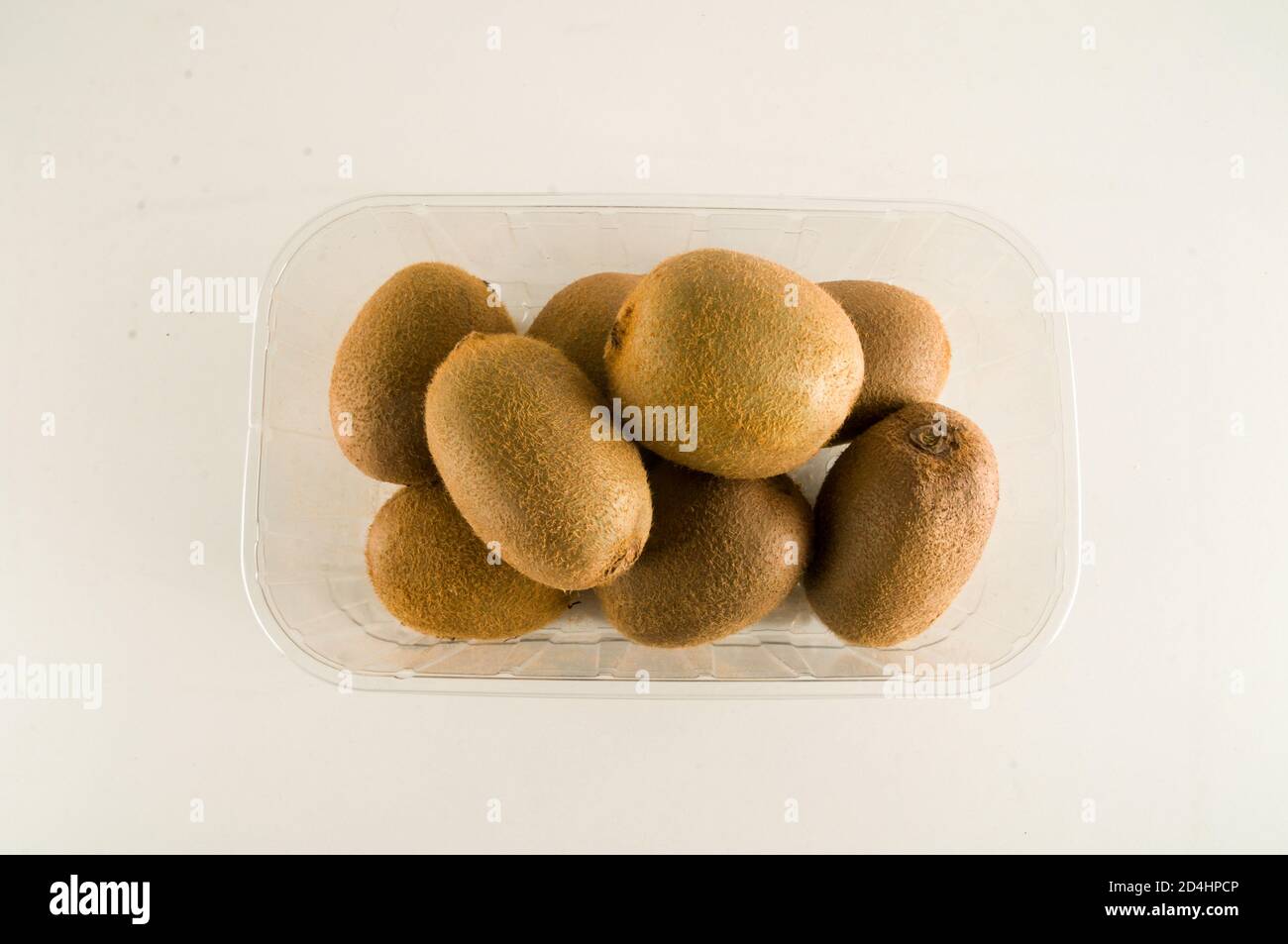 Kiwi in a box isolated Stock Photo - Alamy