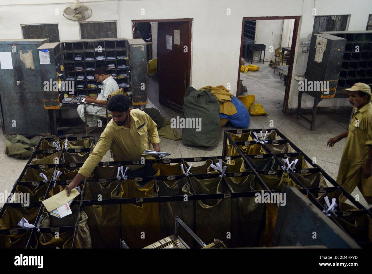 Pakistani post office worker sorts mails after it was unloaded from ...