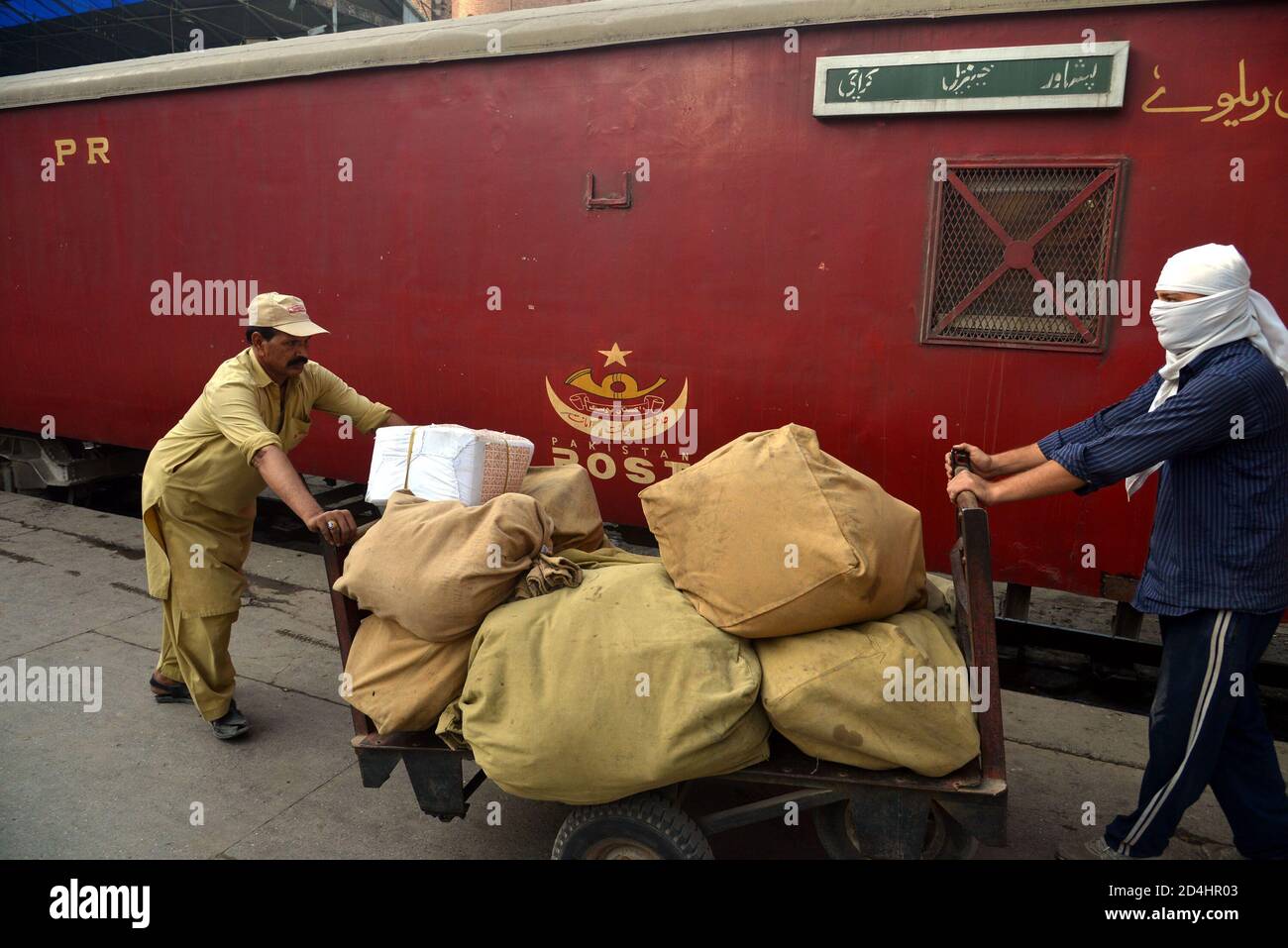 Pakistani post office worker sorts mails after it was unloaded from ...