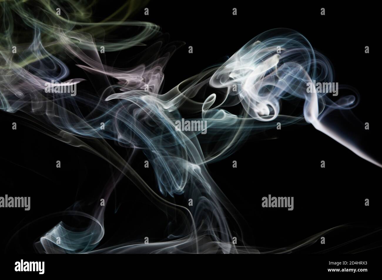 Abstract smoke swirls flow on black isolated background Stock Photo - Alamy