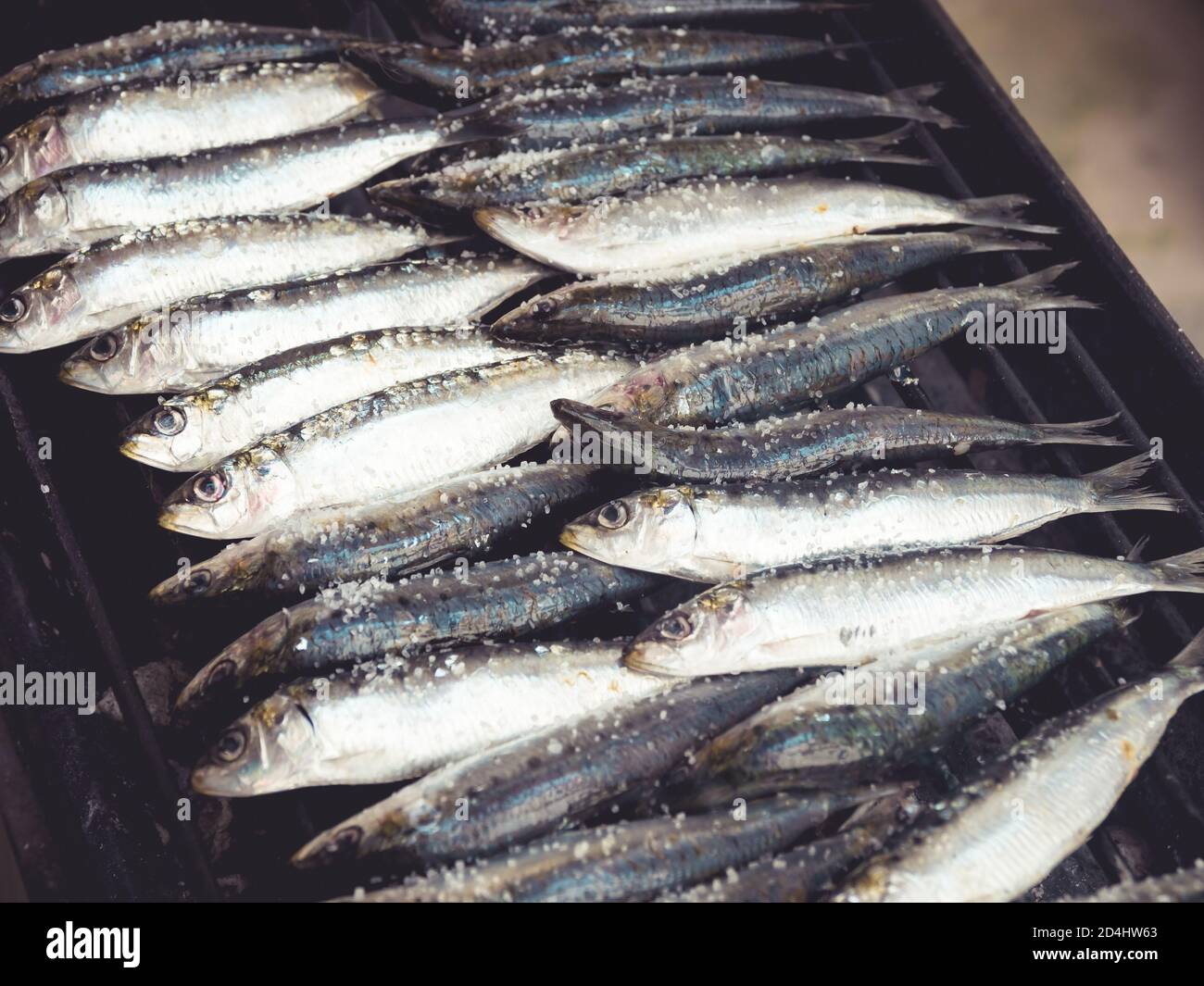 Top view of a sardines grilling process Stock Photo - Alamy