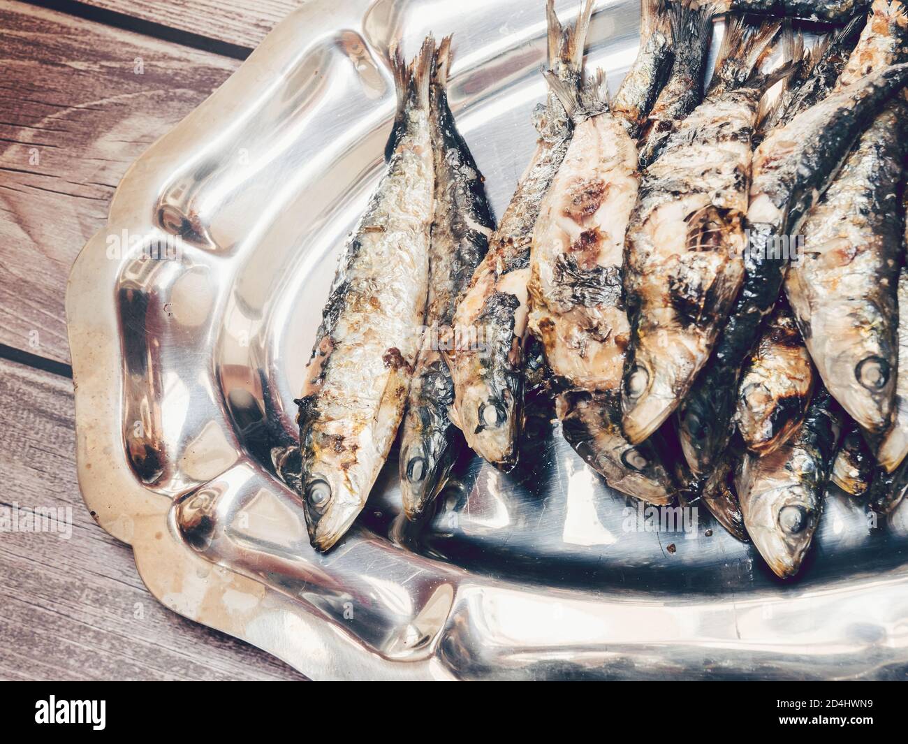 Top view of a sardines grilling process Stock Photo - Alamy
