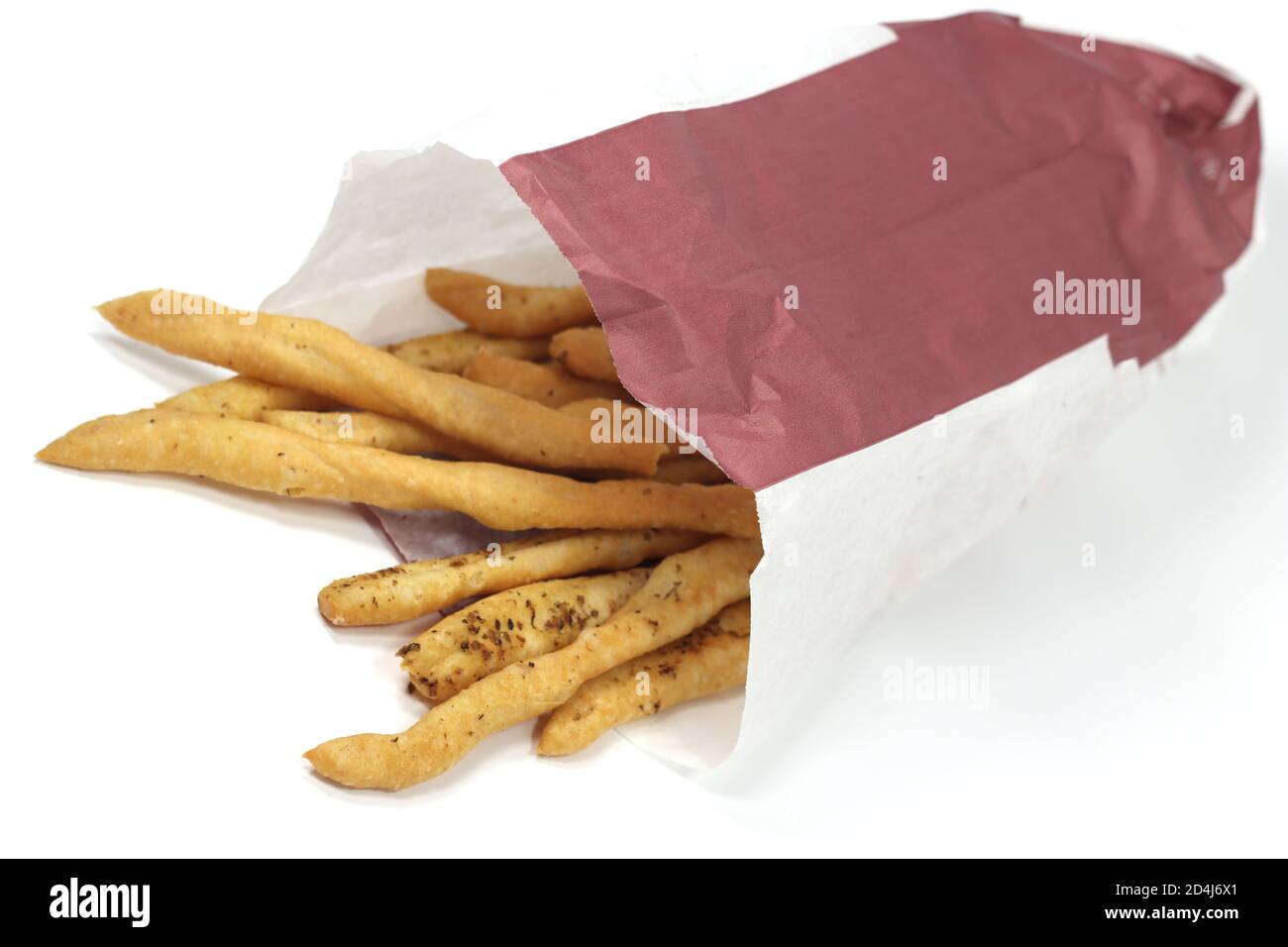 Closeup shot of fresh breadsticks in a paper package isolated on a ...