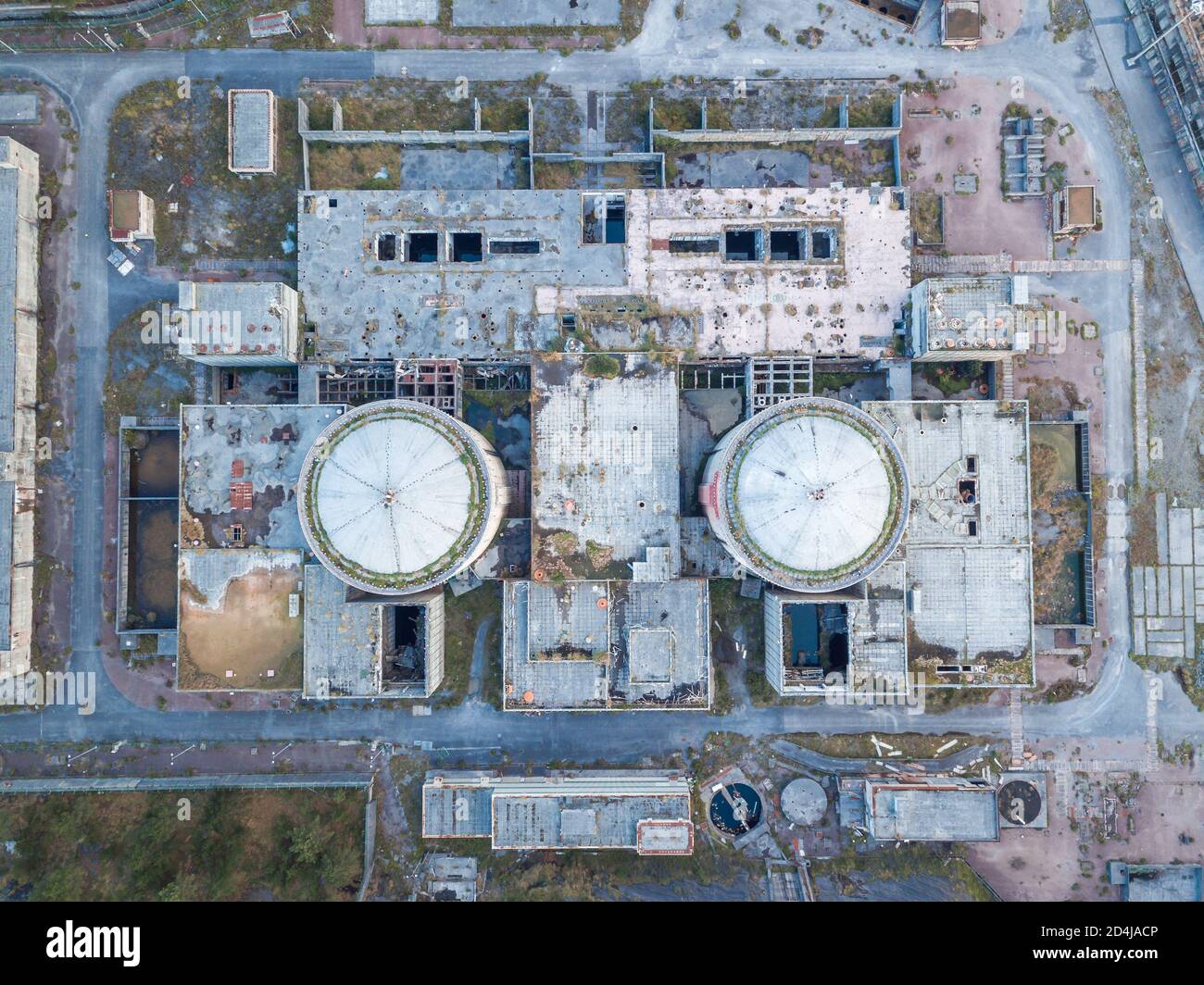 Aerial top view of the remains of an old nuclear power plant in the ...