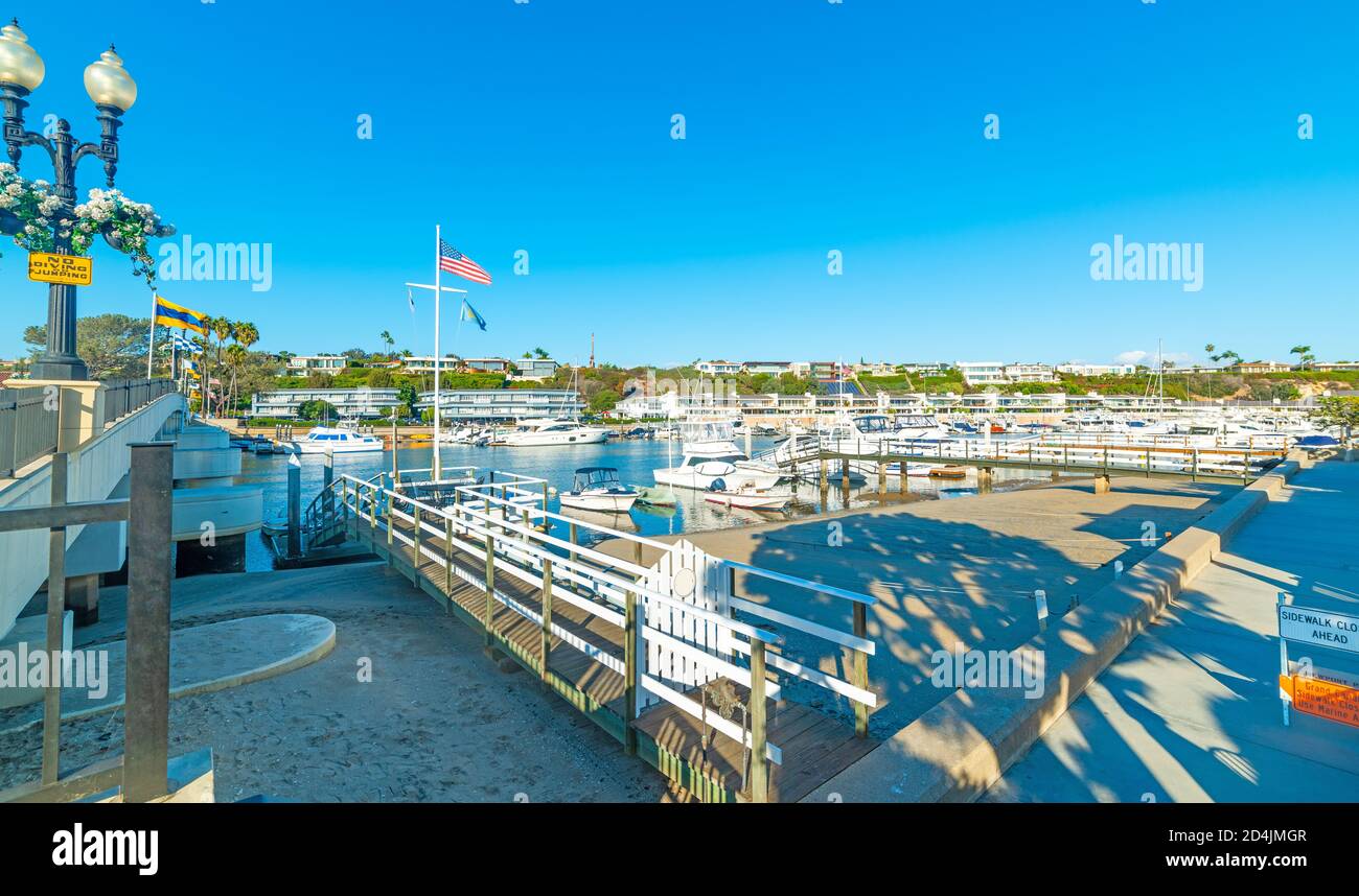 Balboa island small harbor under a clear sky. Orange County, California ...