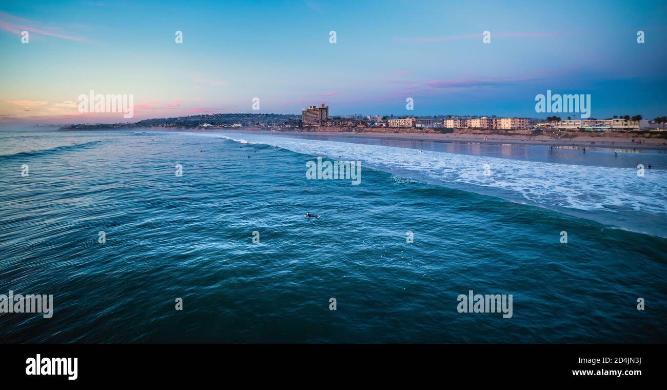 Surfers in Pacific Beach at sunset. San Diego, USA Stock Photo - Alamy