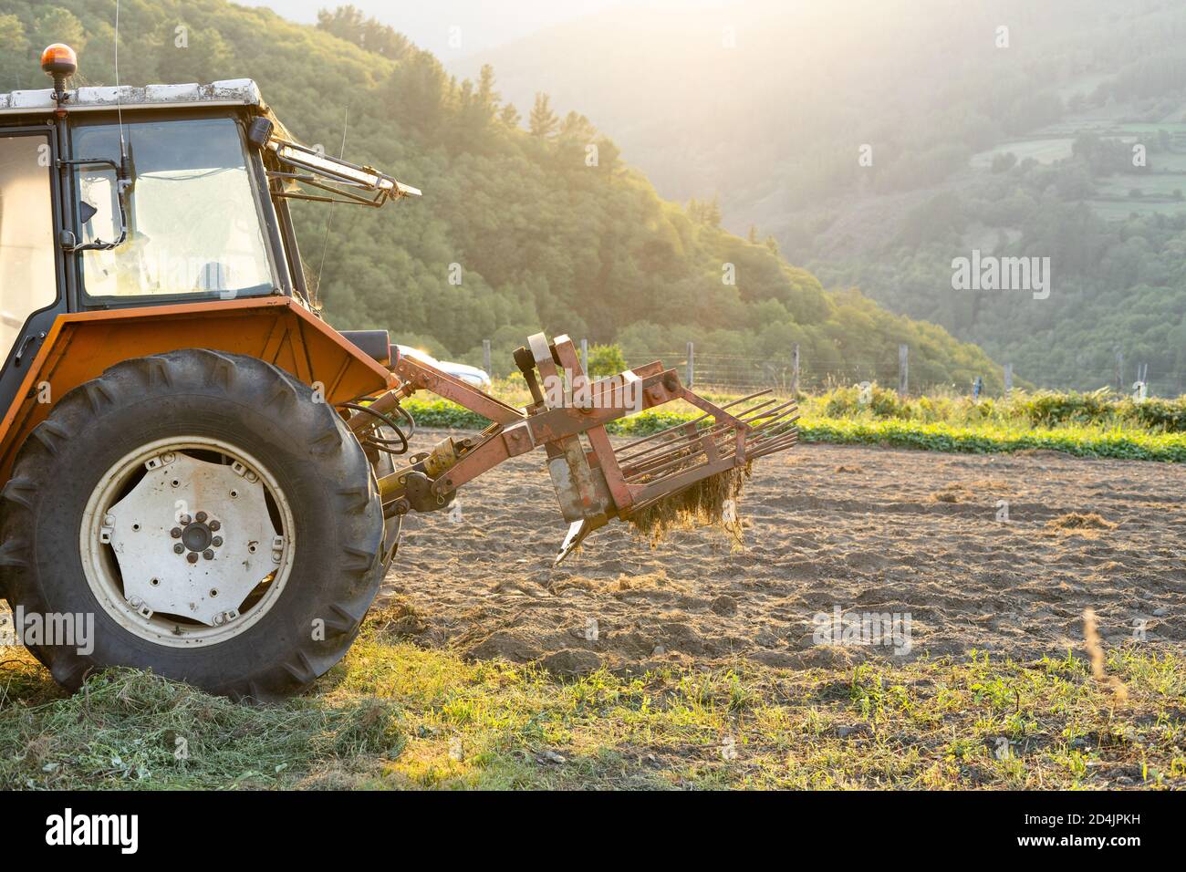 Tractor with potato harvesting equipment. Agriculture. Rural world ...