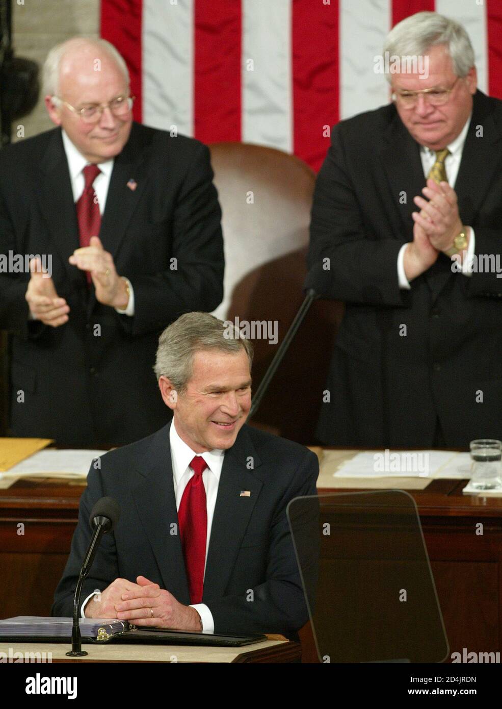 Hastert behind bush hi-res stock photography and images - Alamy