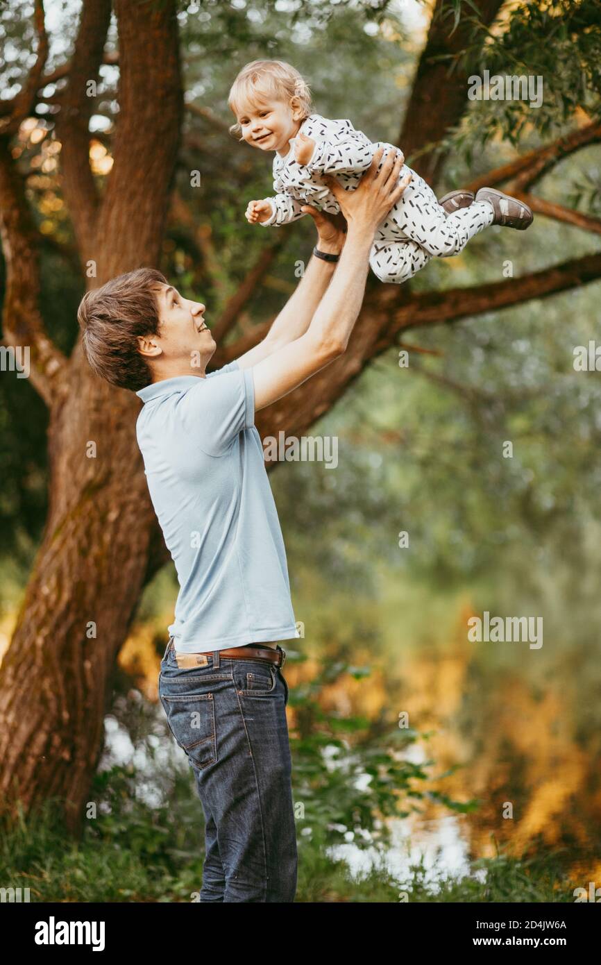 happy family father and son walking in nature Stock Photo - Alamy