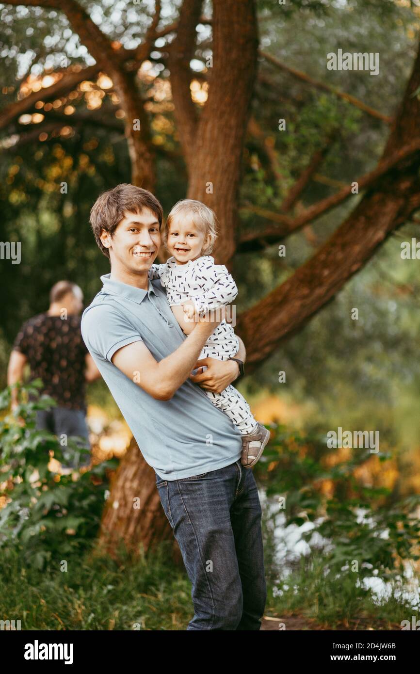 happy family father and son walking in nature Stock Photo - Alamy
