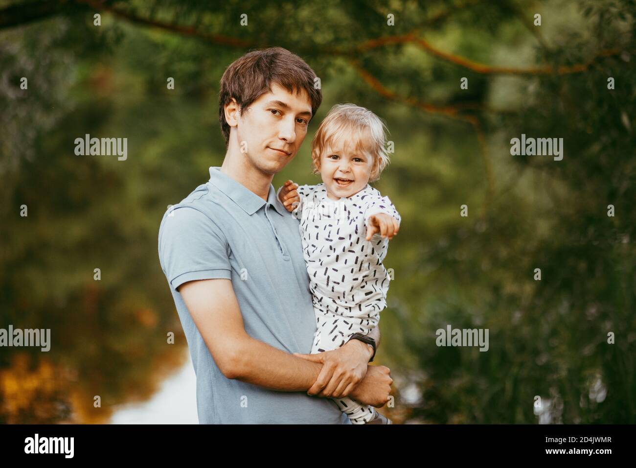 happy family father and son walking in nature Stock Photo - Alamy