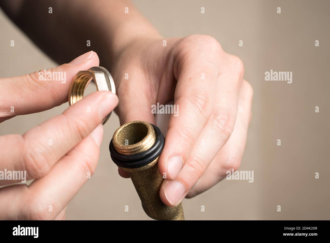 The plumber's hands Unscrew the nut from the valve tap. Side view Stock ... The plumber's hands Unscrew the nut from the valve tap. Side view Stock ...