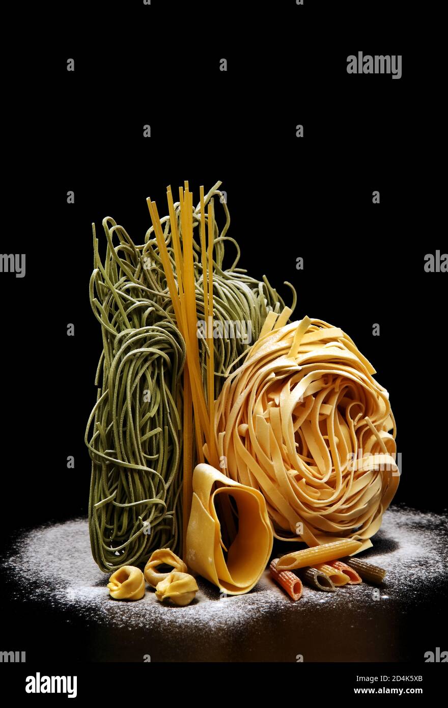 dry pasta on black background Stock Photo - Alamy
