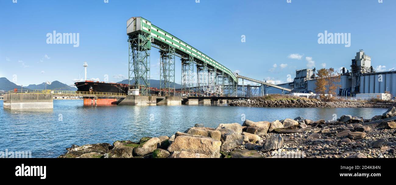 Port facility for grains, oil seeds and pulses. A large cargo tanker is ...
