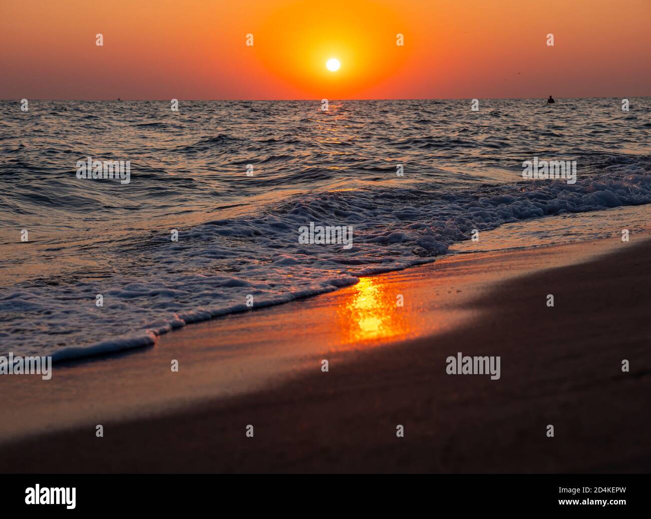 sunrise over the sea and the beach Stock Photo - Alamy