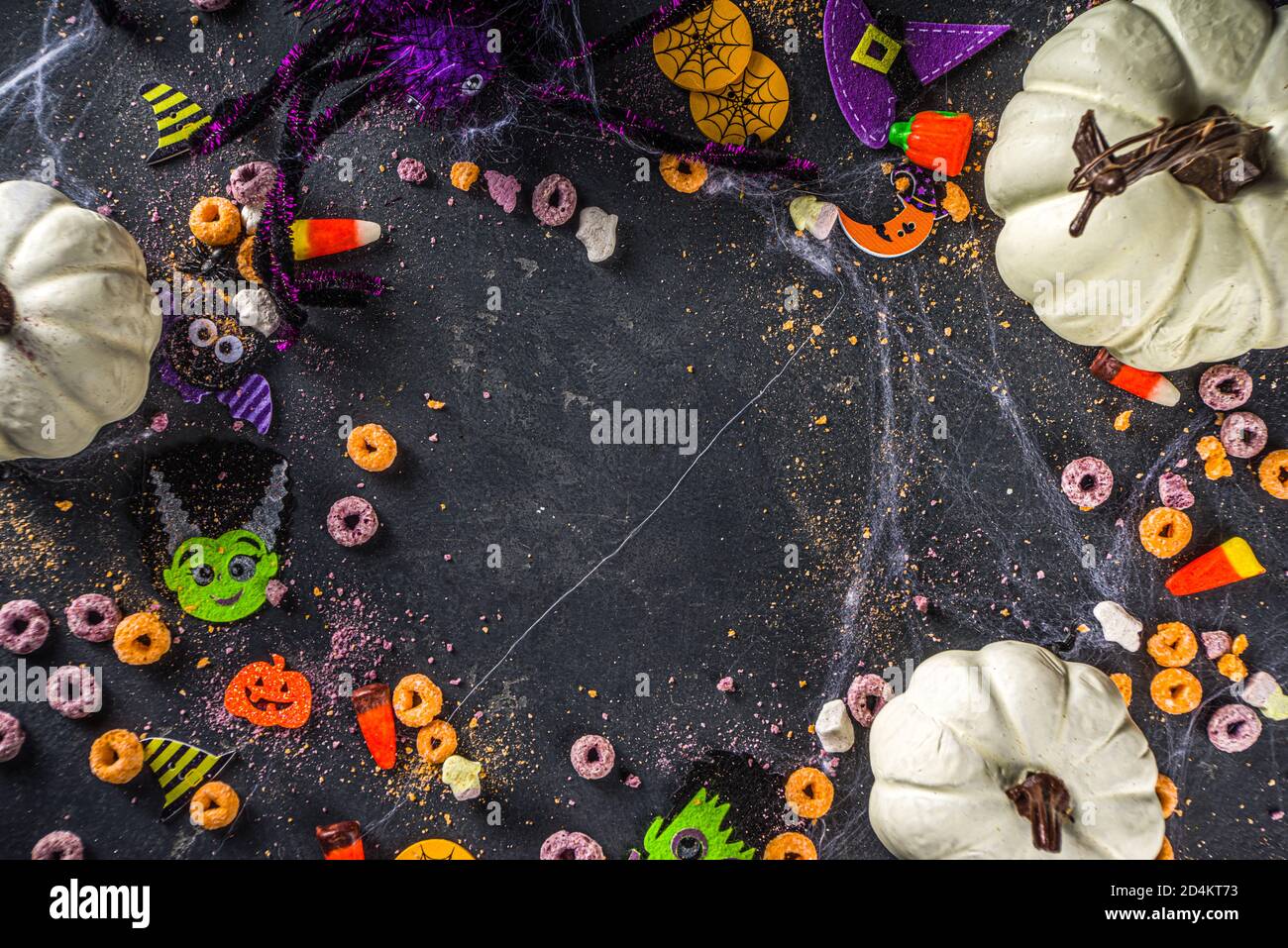 Halloween kids food and sweets background, dark table top view frame ...