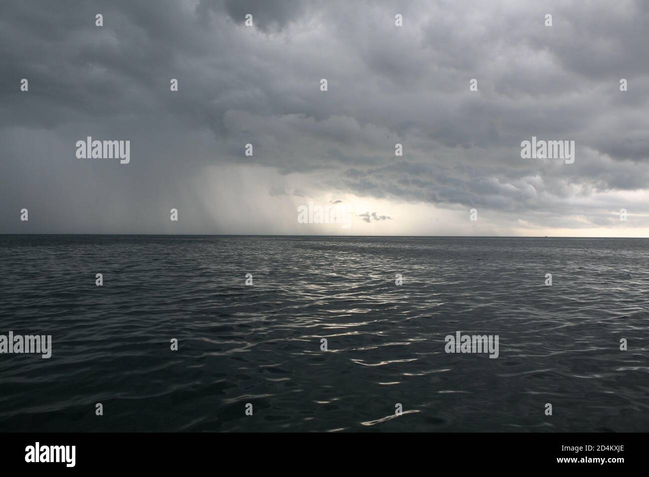 Rain at sea Stock Photo - Alamy