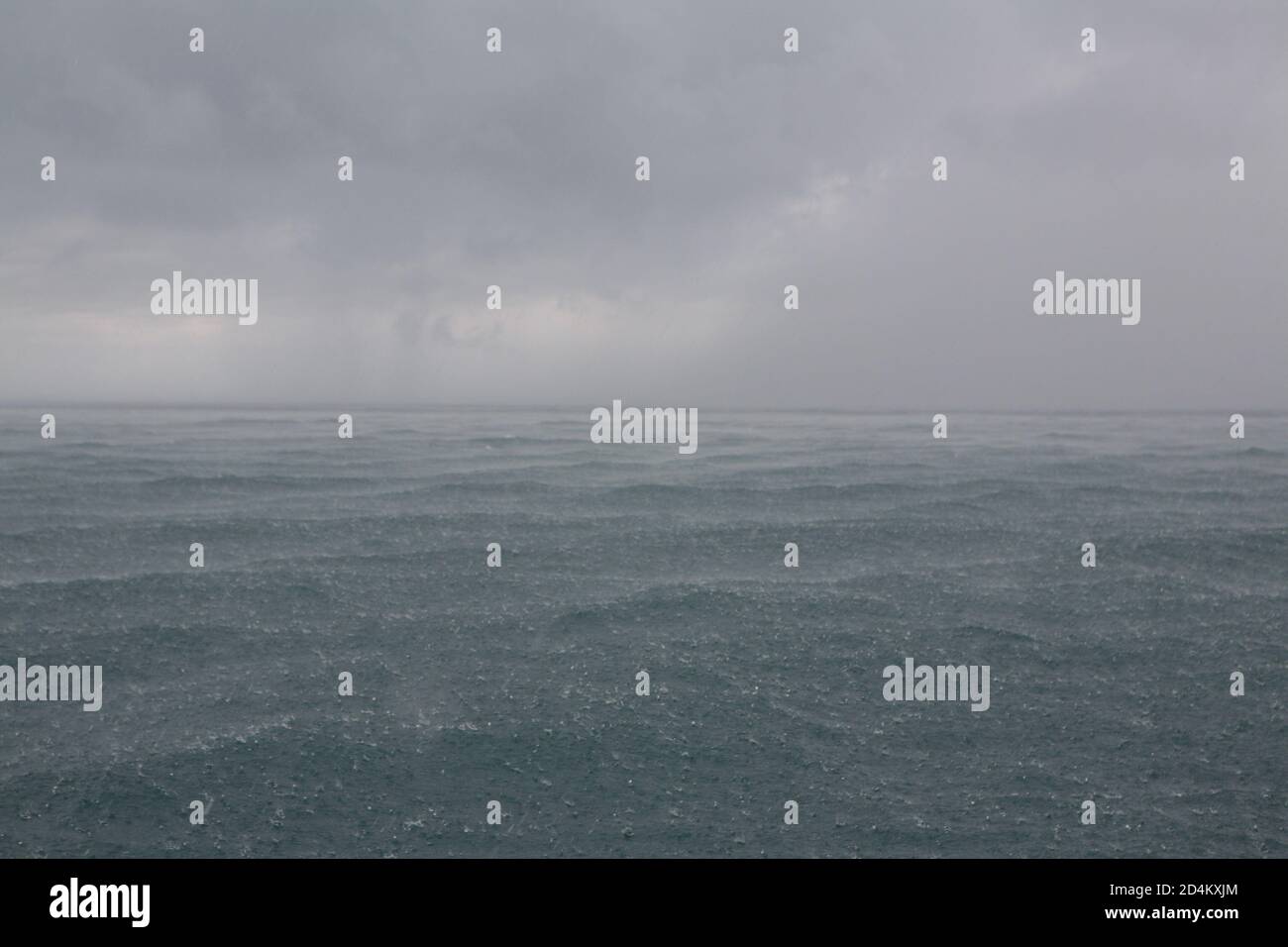 Rain at sea Stock Photo - Alamy