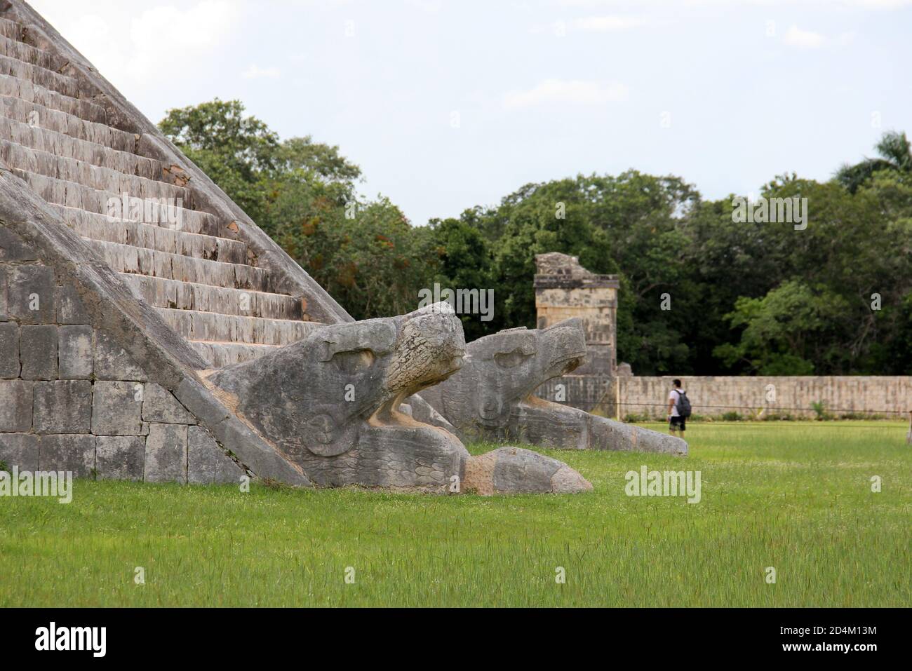 Feathered serpent sculpture at the base of one of the stairways of ...