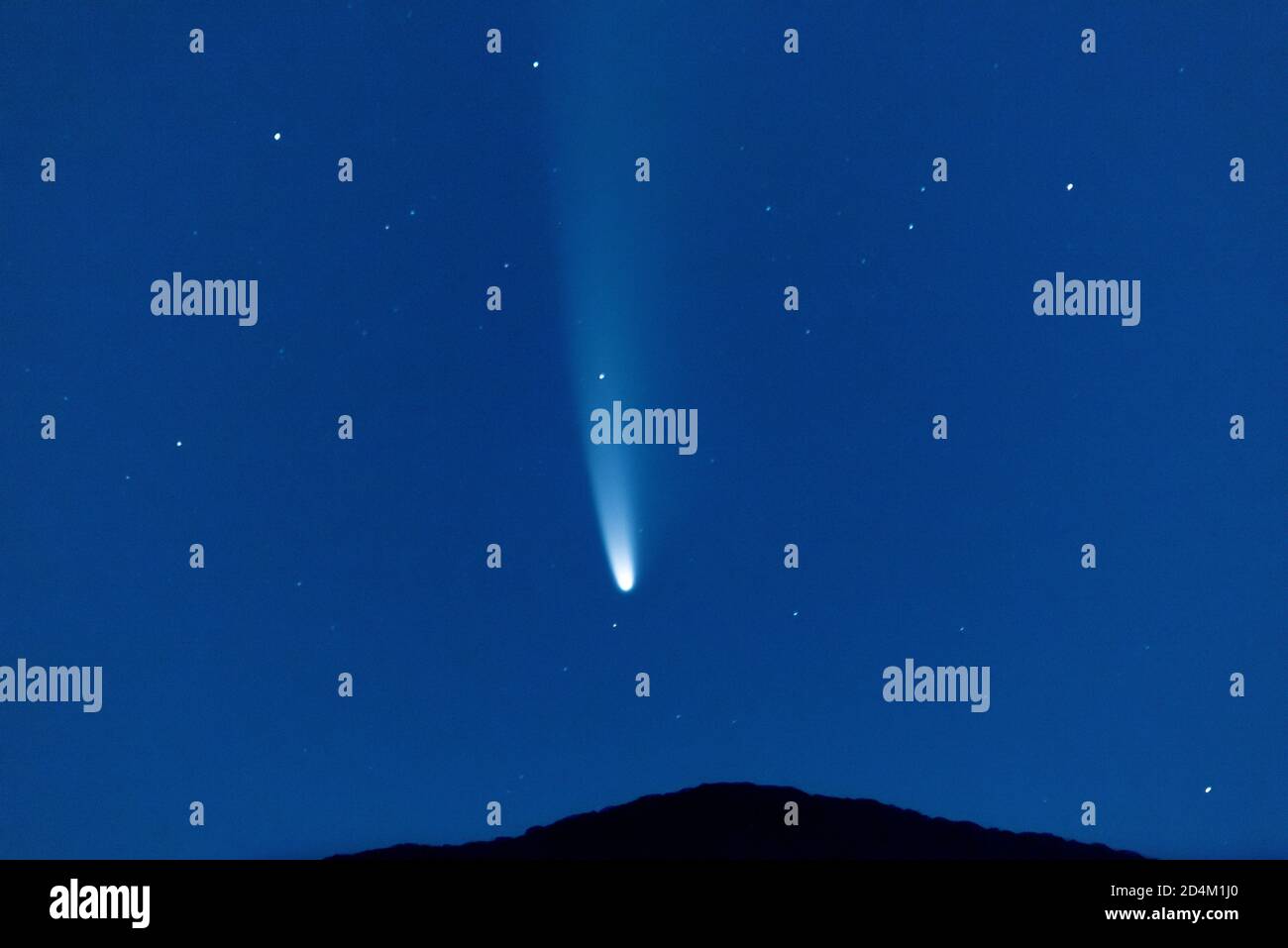 Comet falling in a night sky over a mountain Stock Photo - Alamy