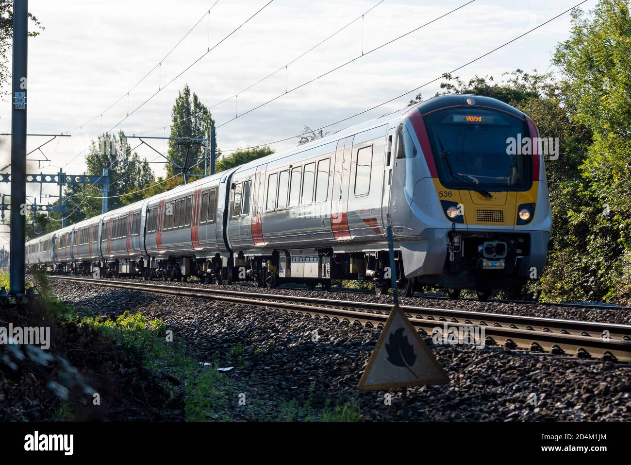 British Rail Class 720 Aventra train of Greater Anglia passing Hawkwell, Rochford, near Southend ...