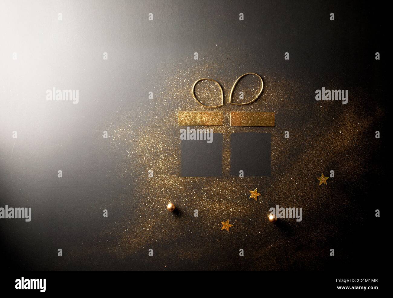 Gift box shape made with gold glitter and ribbon bow Stock Photo - Alamy