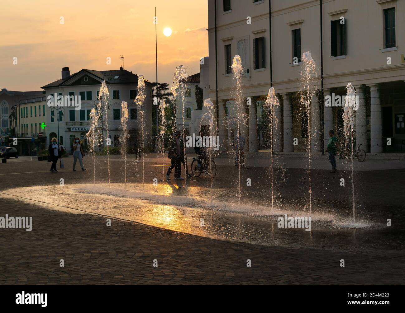 Water splashes from the fountain in the central square of the city of ...