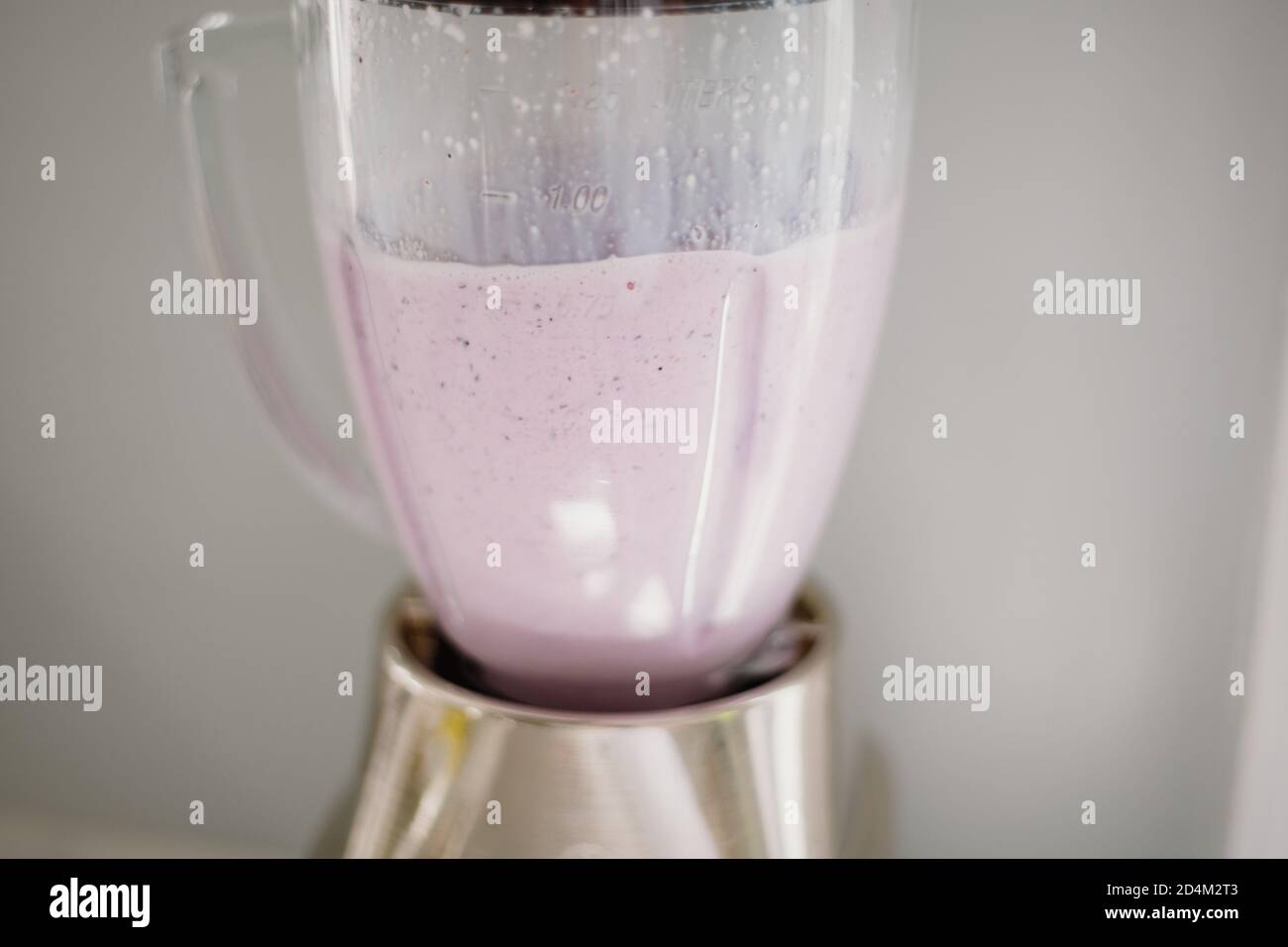 Blueberry smoothie in blender, close up Stock Photo - Alamy