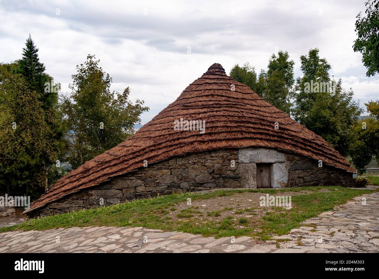 traditional house of O Cebreiro town known as Palloza, with thatched ...